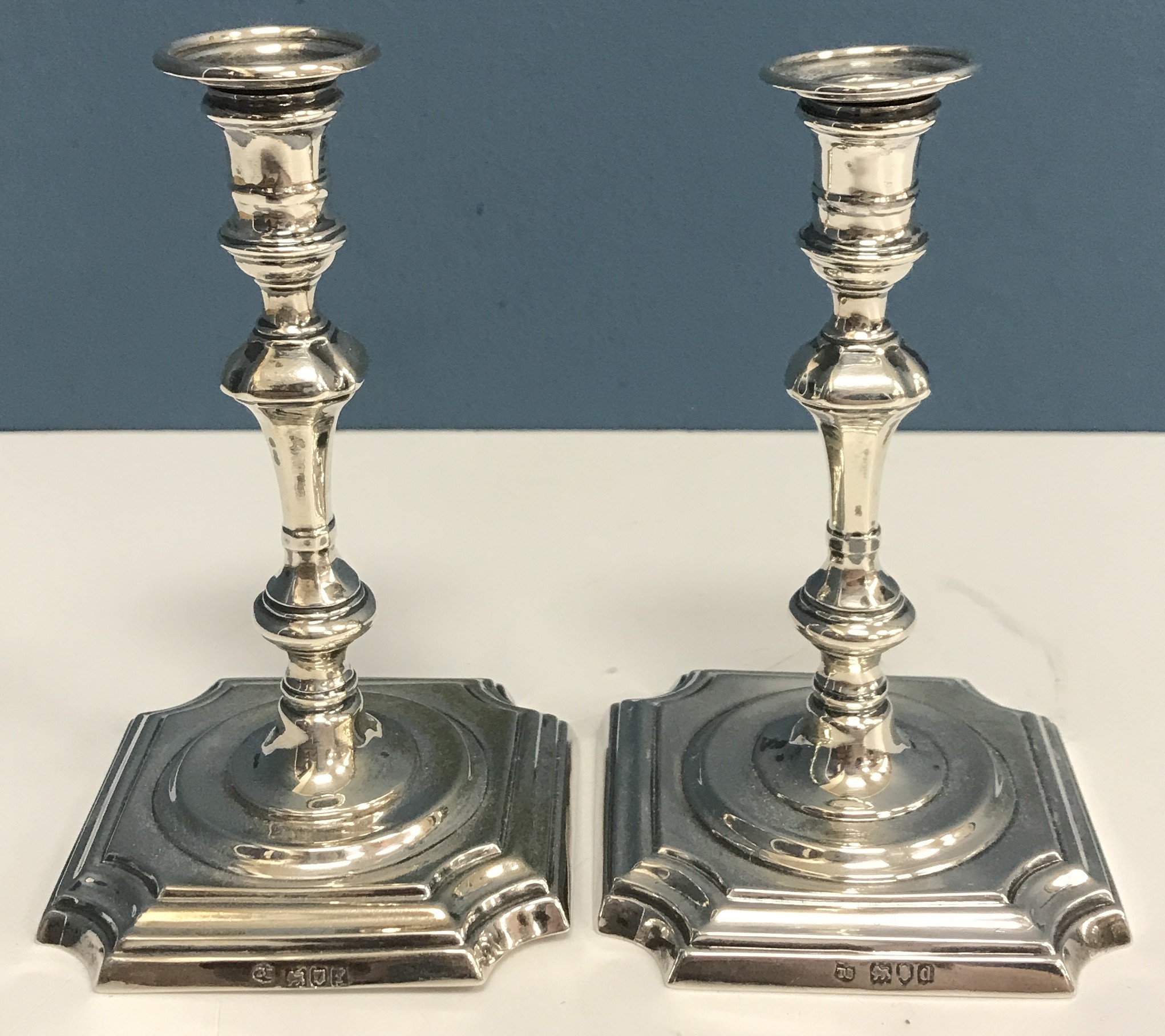 A pair of late Victorian silver taper sticks in the early Georgian ...