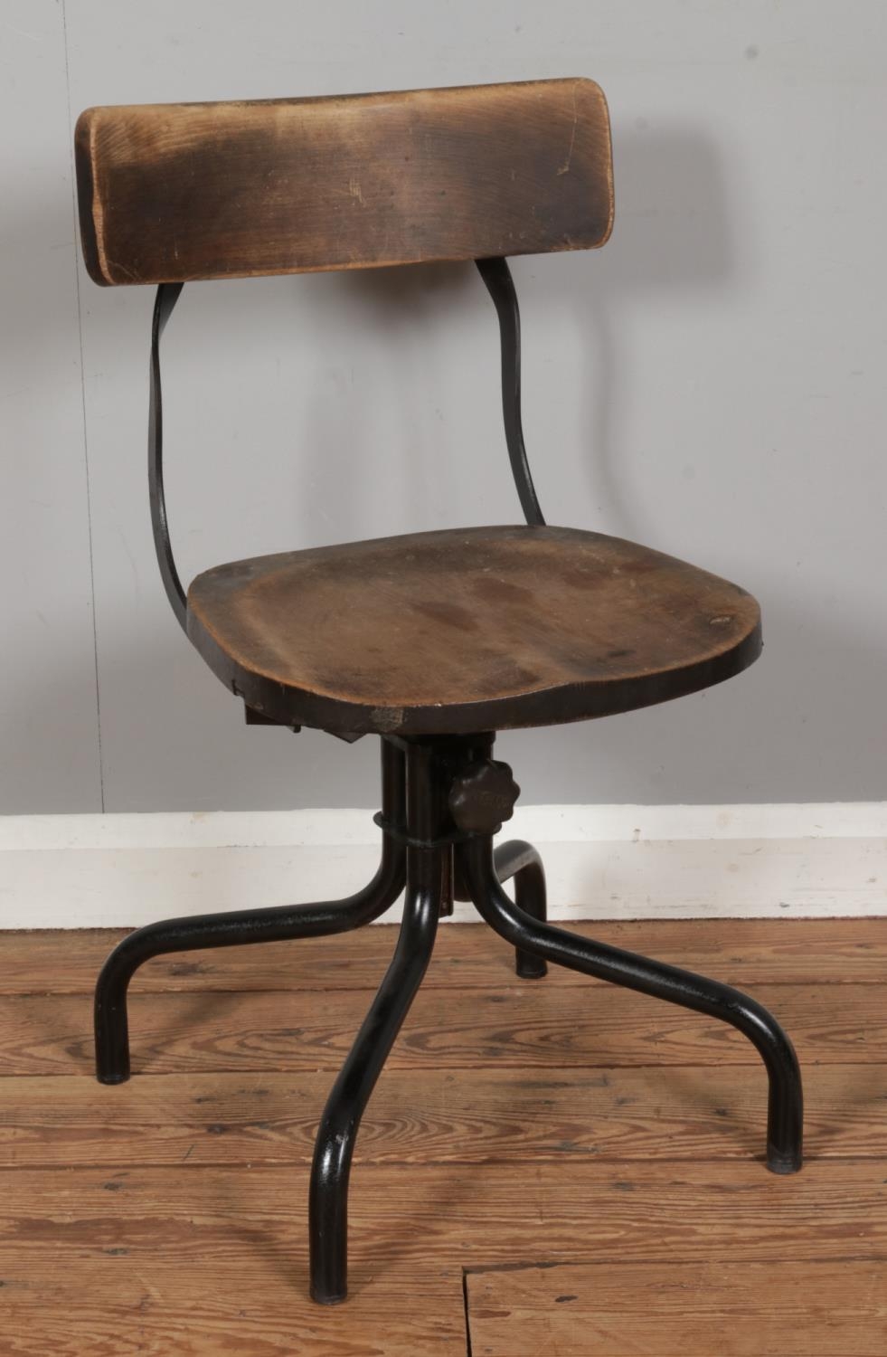 A Tansad swivel height adjustable desk chair with a later oak seat on a ...