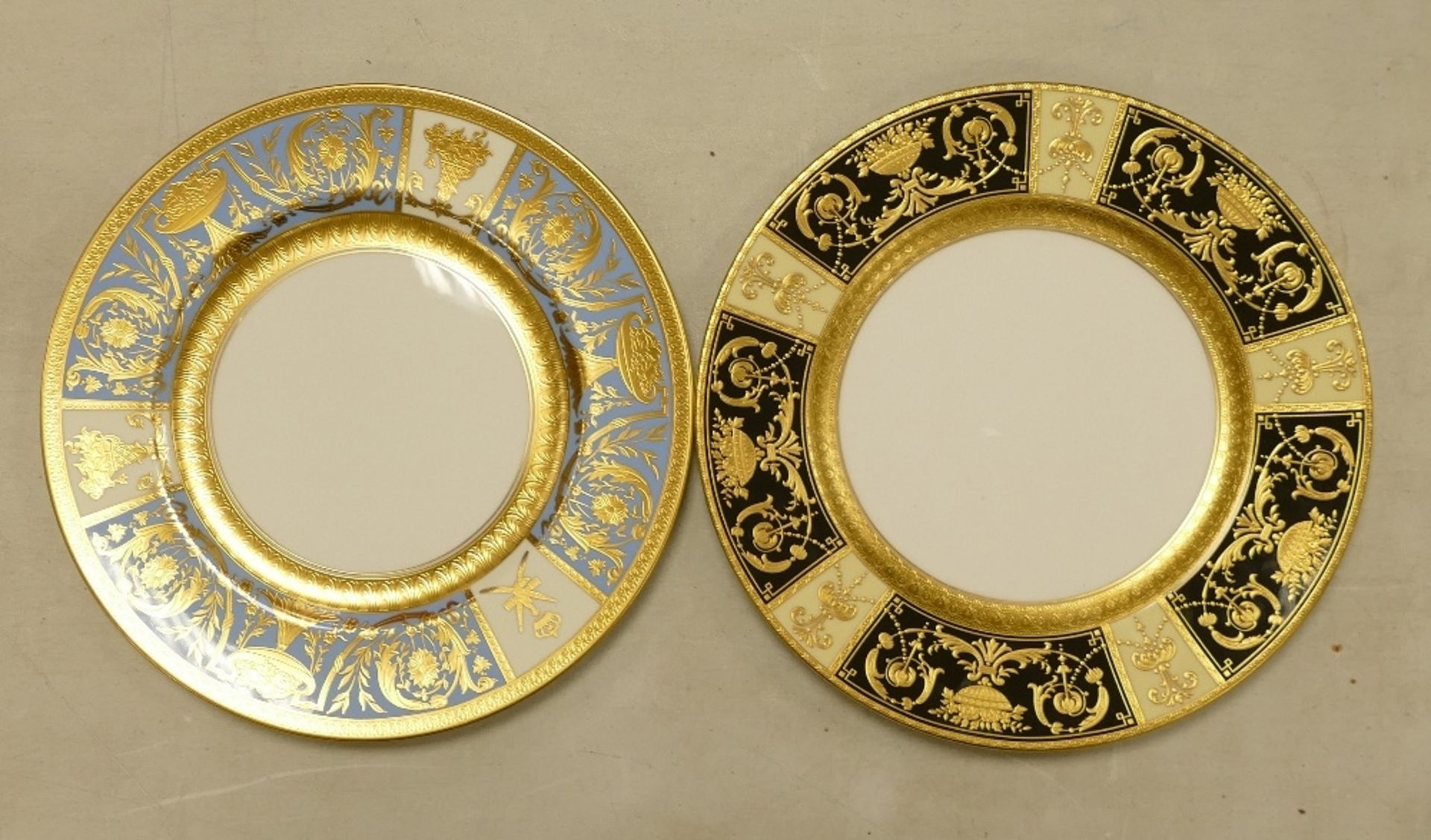 De Lamerie Fine Bone China, a selection of heavily gilt plates in ...