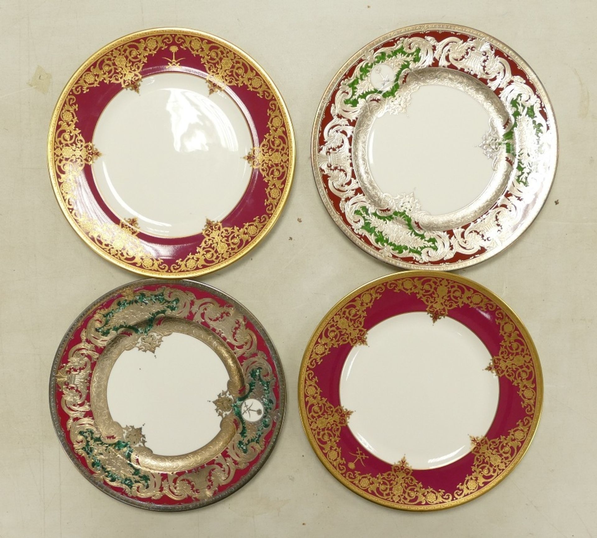 De Lamerie Fine Bone China, a selection of heavily gilt plates in ...