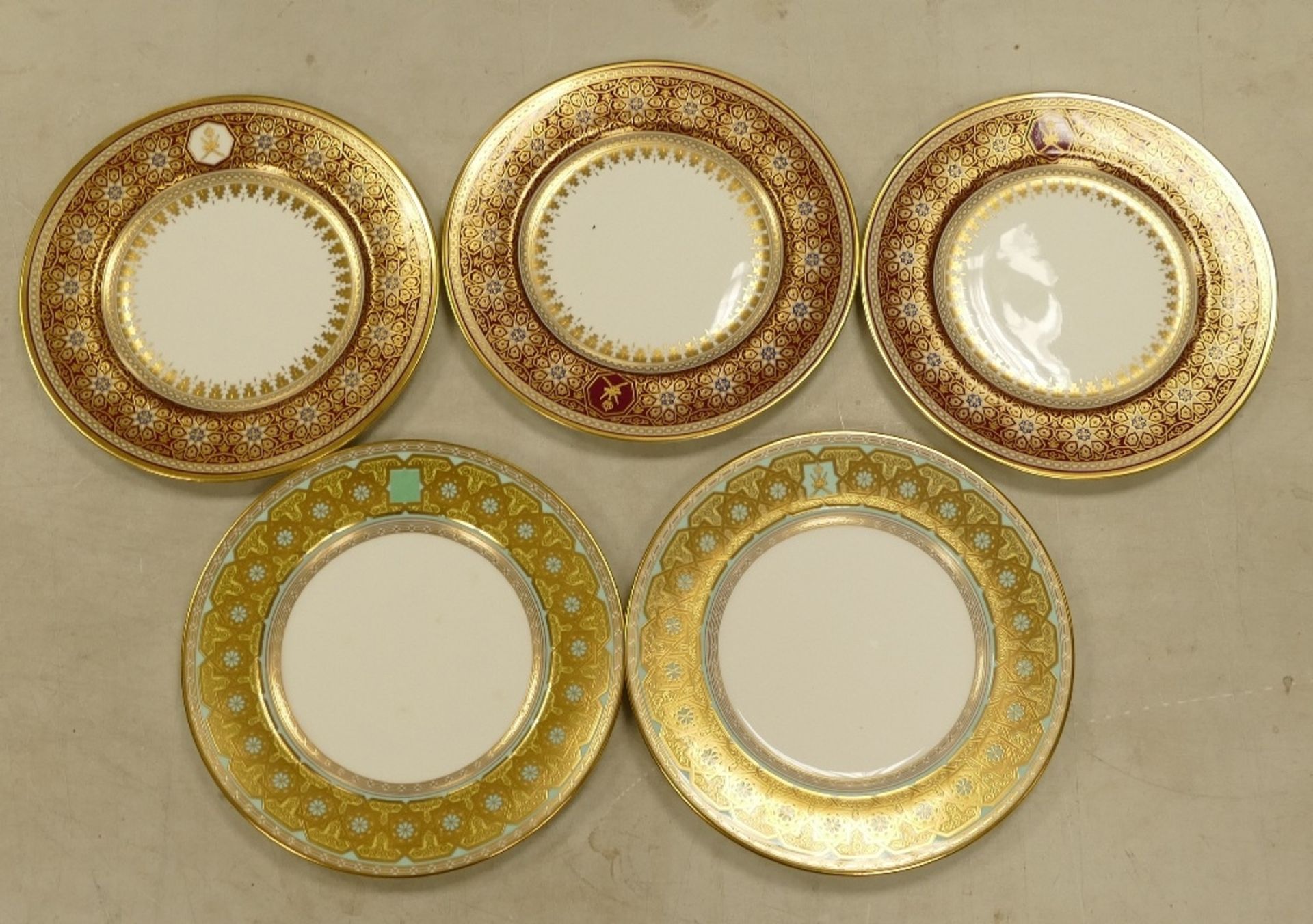 De Lamerie Fine Bone China, a selection of heavily gilt plates in ...