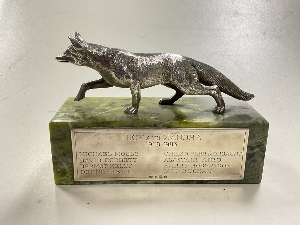 A cast silver fox hunting trophy on a rectangular Connemara marble ...