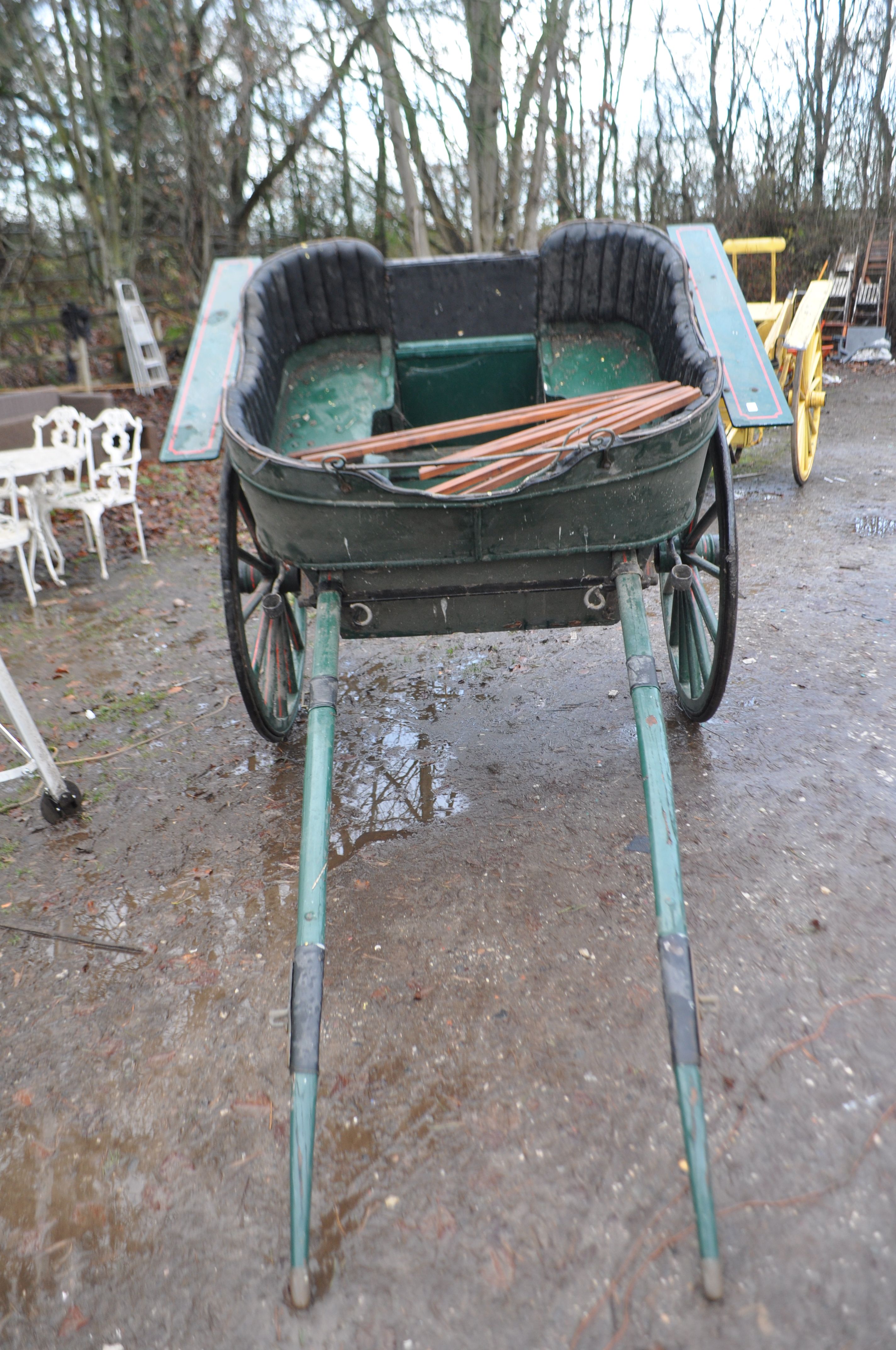 A TWO BENCH SEAT HORSE DRAWN GOVERNESS CART, with leaf spring ...