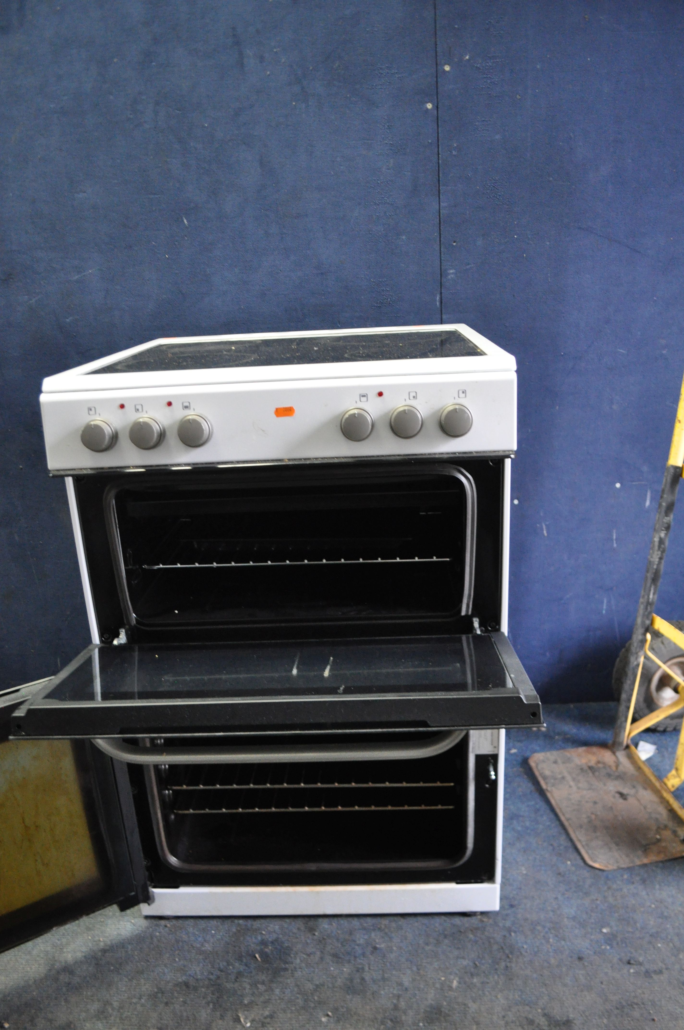 A LOGIK ELECTRIC COOKER with ceramic hob, width 60cm, depth 64cm ...