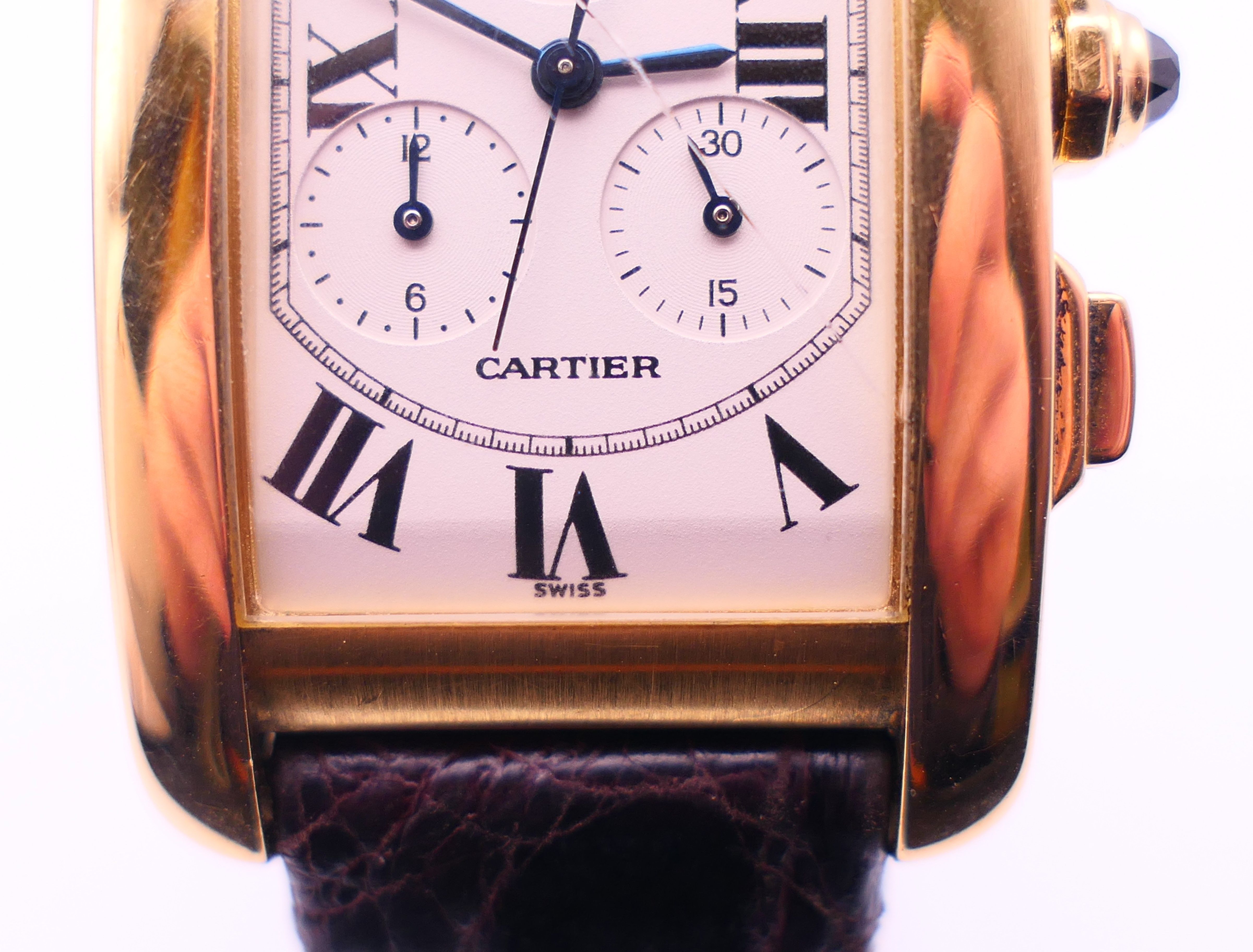 A boxed 18 ct gold Cartier Tank Americaine gentlemen's wristwatch. 3 cm ...