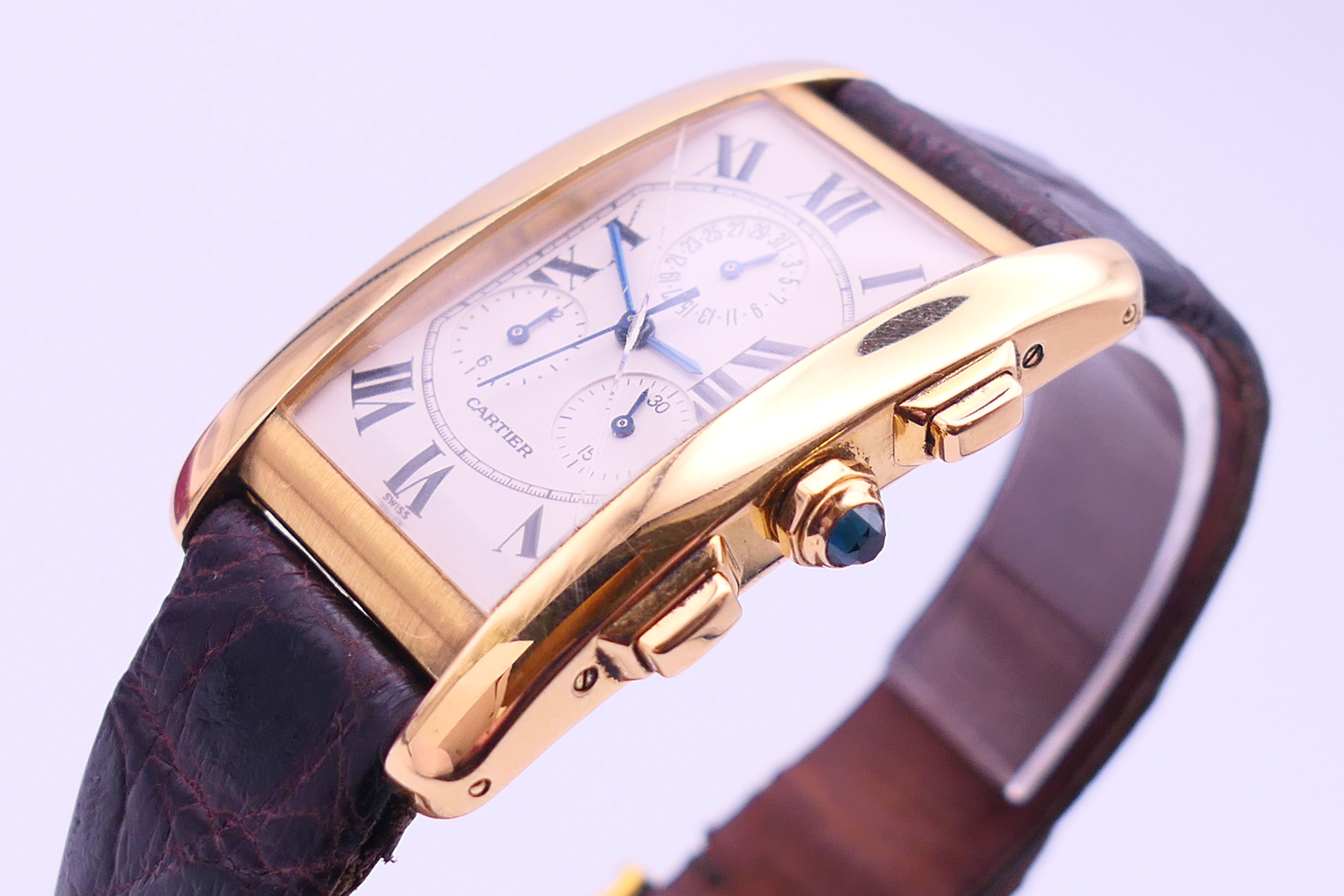 A boxed 18 ct gold Cartier Tank Americaine gentlemen's wristwatch. 3 cm ...
