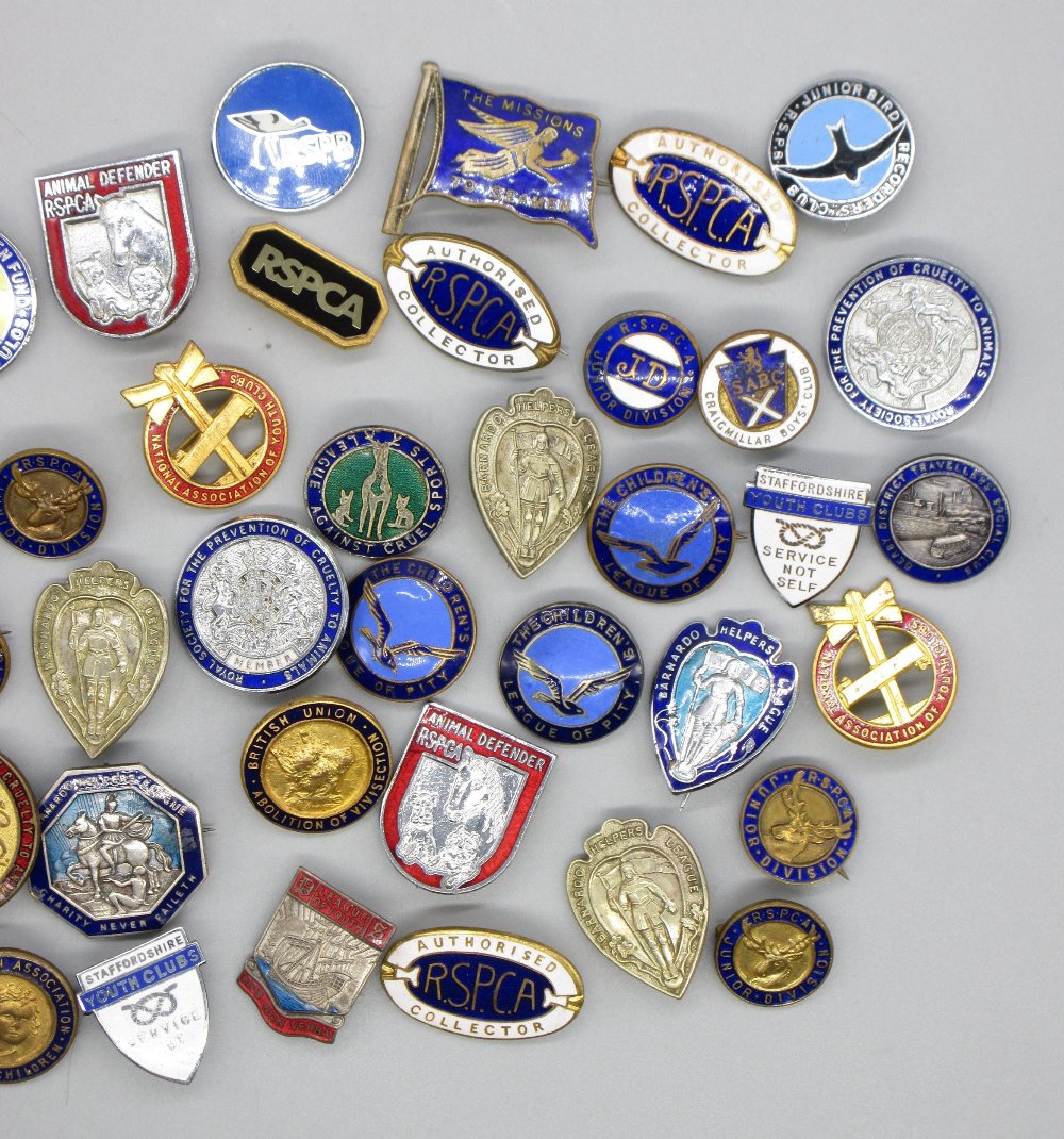 Collection of pin badges relating to NSPCC, Barnardo Helpers League ...