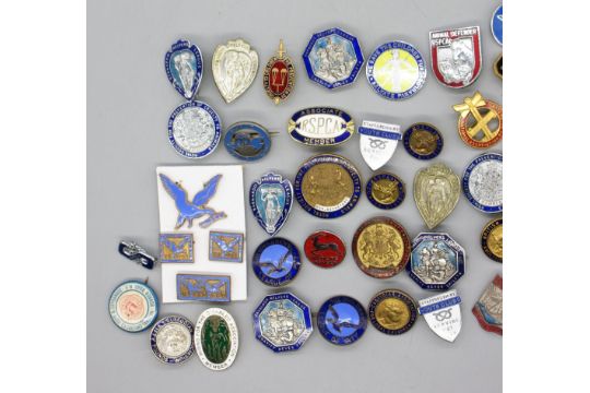 Collection of pin badges relating to NSPCC, Barnardo Helpers League ...