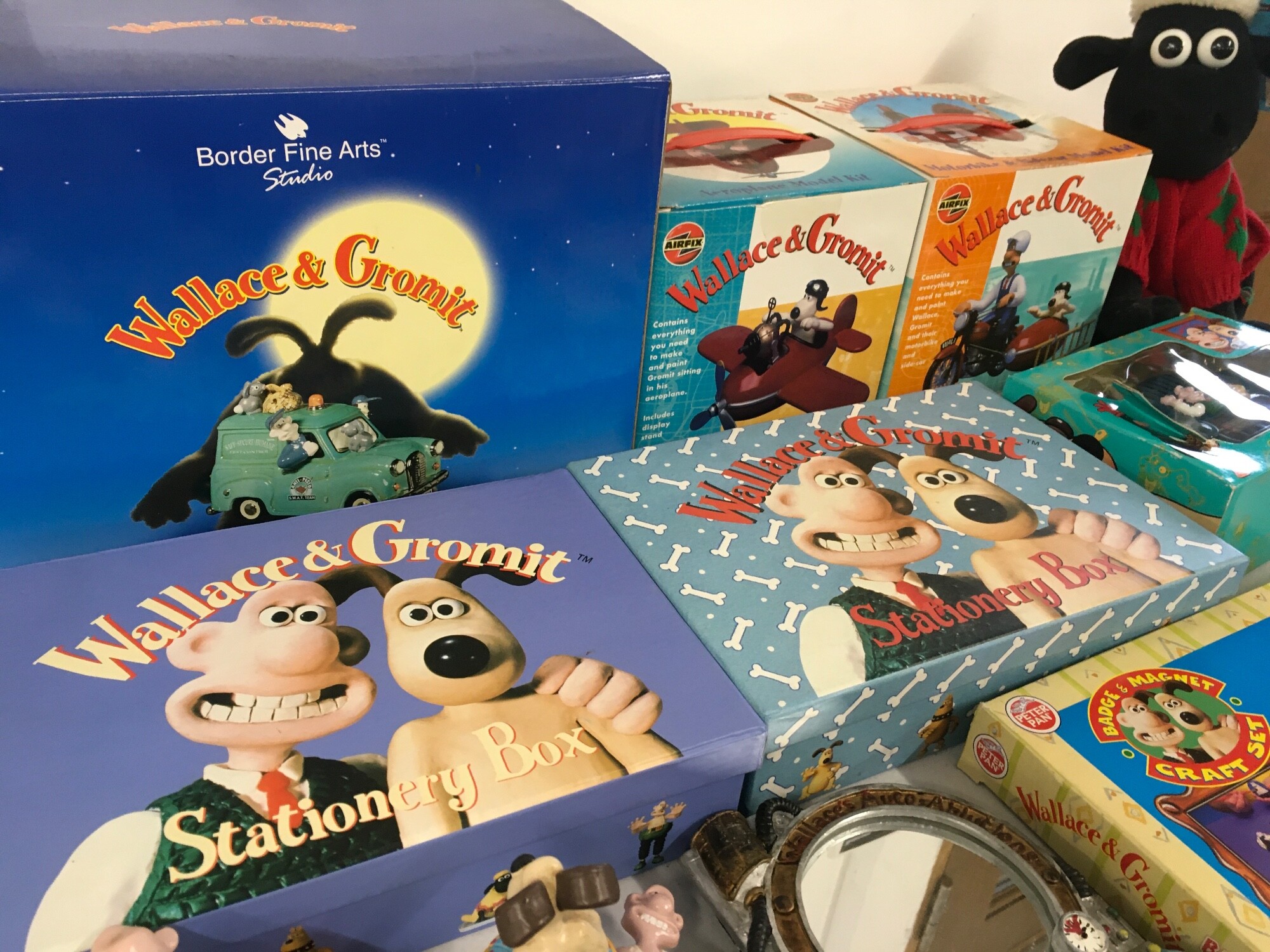 A varied collection of Wallace and Gromit merchandise including, saving ...