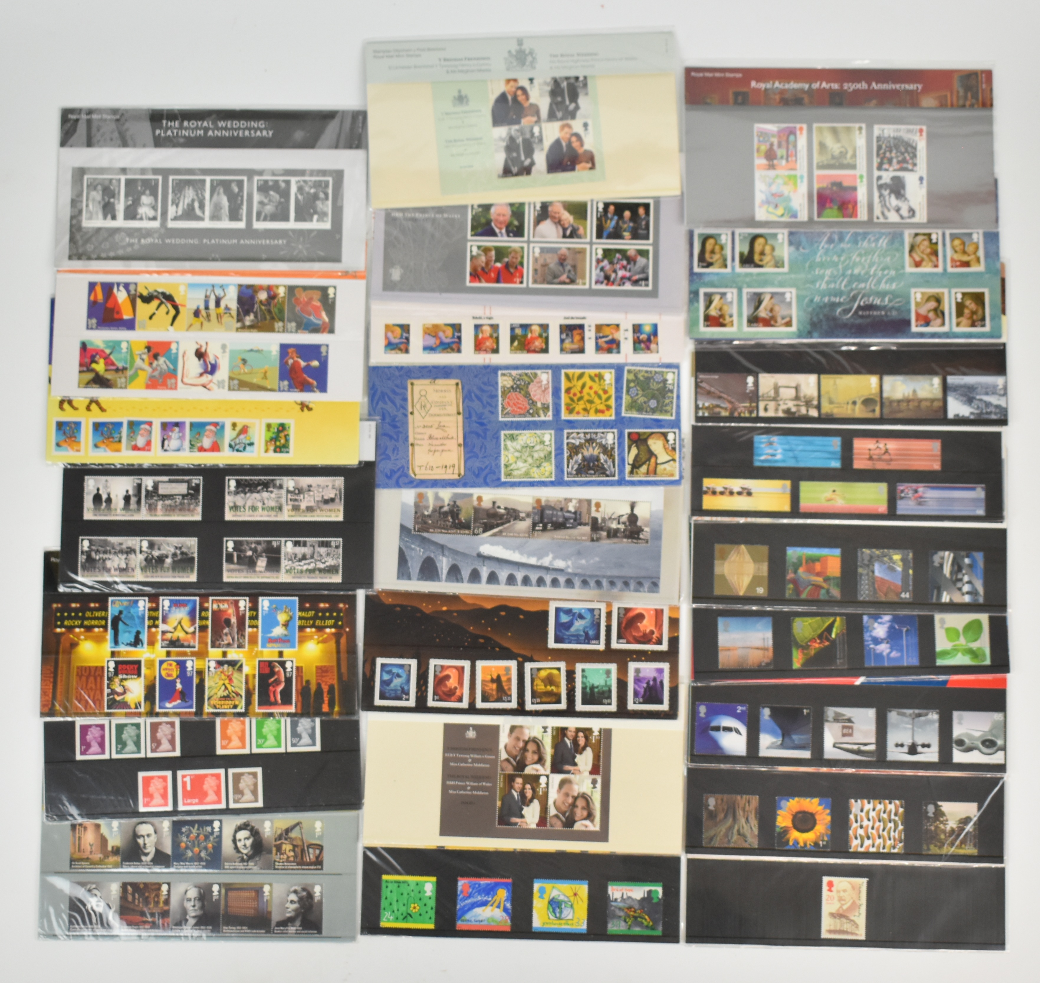 Collection of twenty three Royal Mail stamp presentation packs, face ...