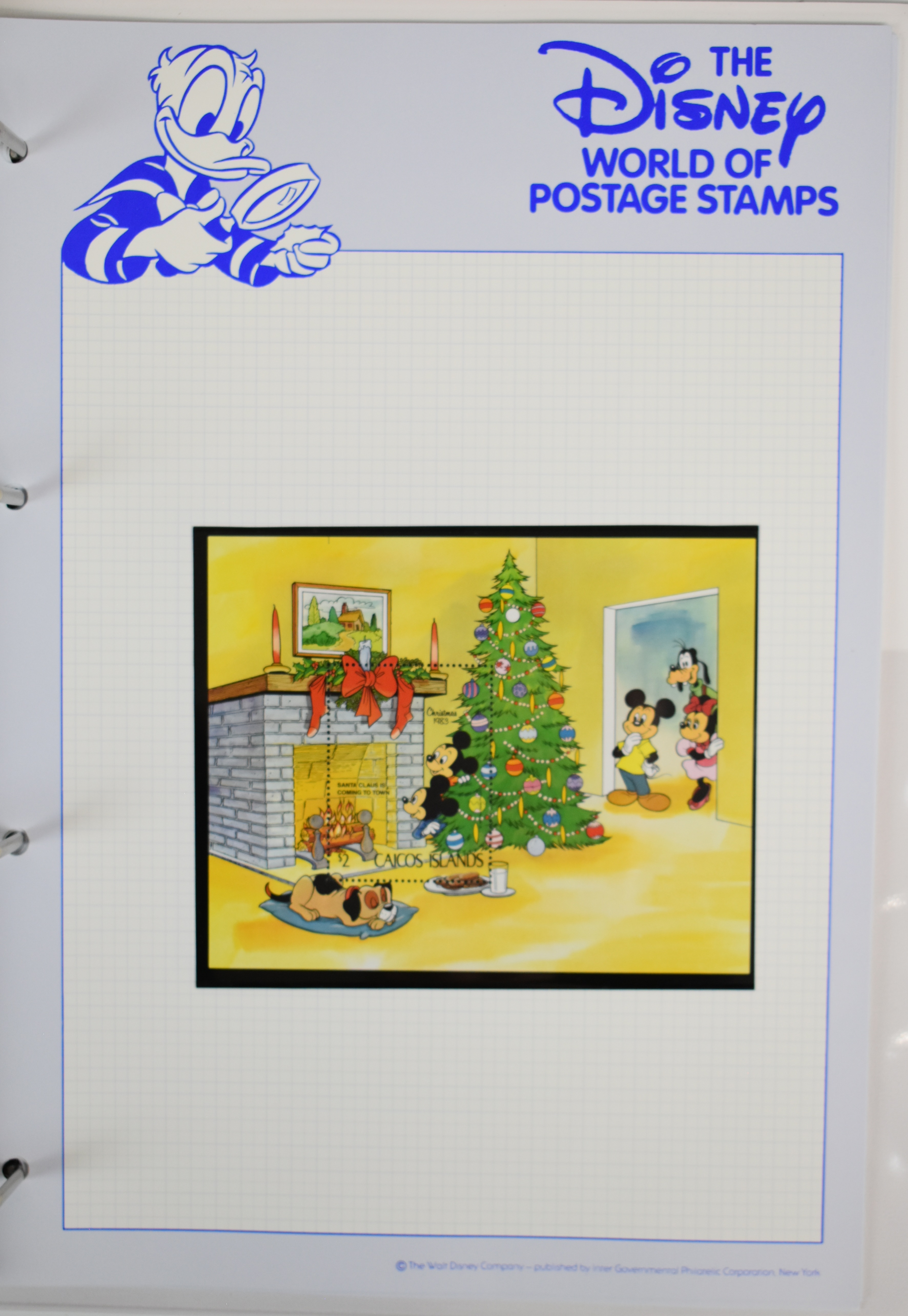 A collection of Disney stamps in two pre-printed albums with miniature ...
