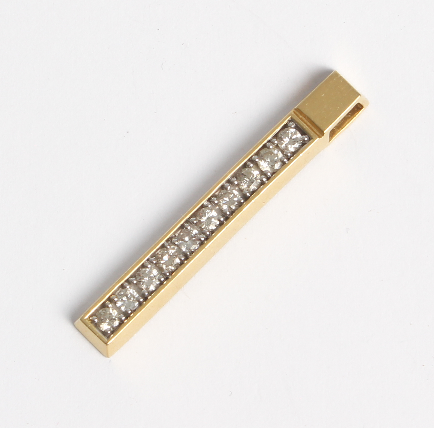 An 18ct yellow gold and diamond knife blade pendant - London import ...