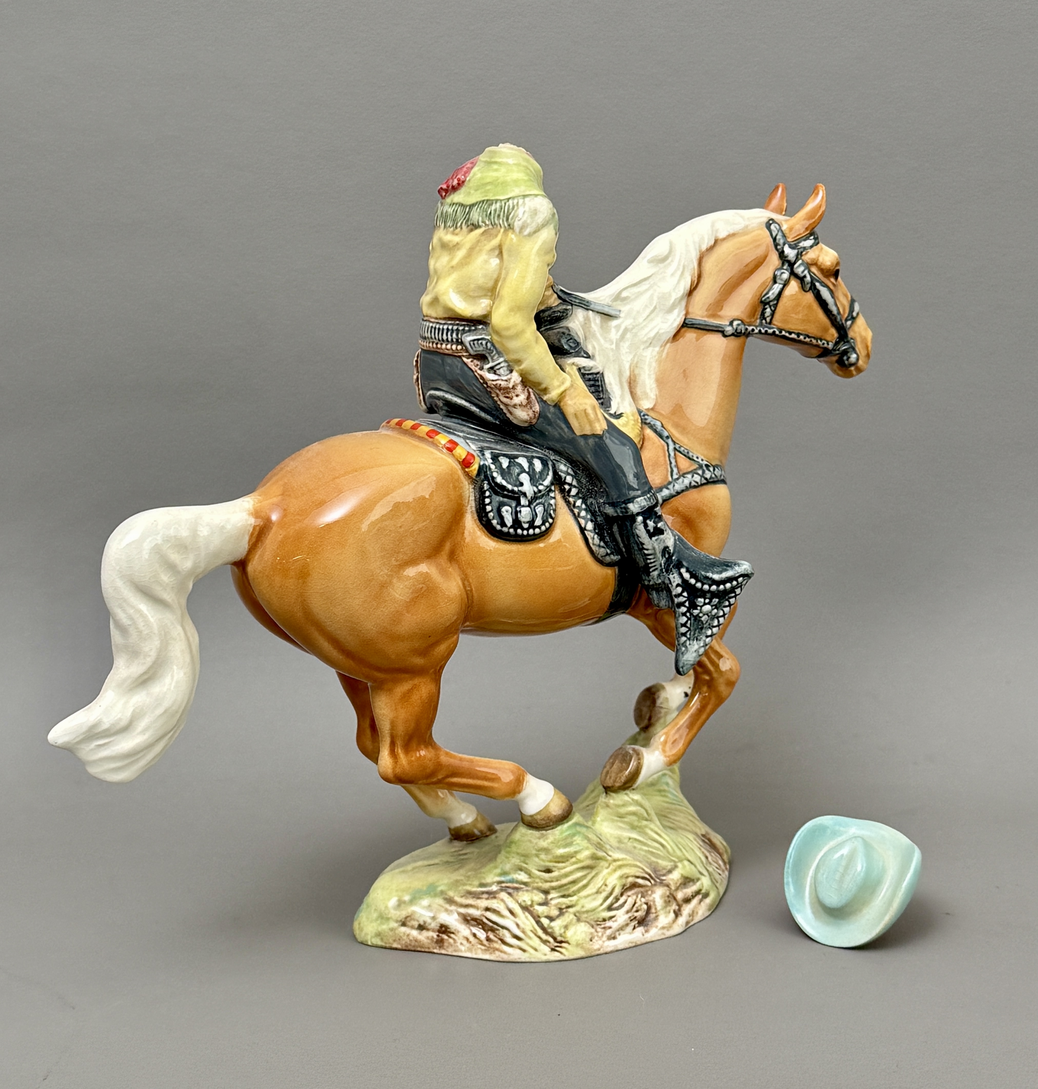 A Beswick figure of a Cowboy mounted on a palomino horse, model 1377 ...