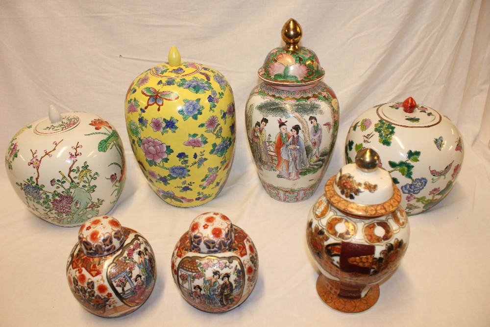A selection of modern Eastern vases and covers and ginger jars etc
