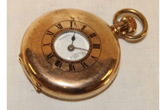 A gentlemans half hunter pocket watch by Bravingtons in gold-plated case