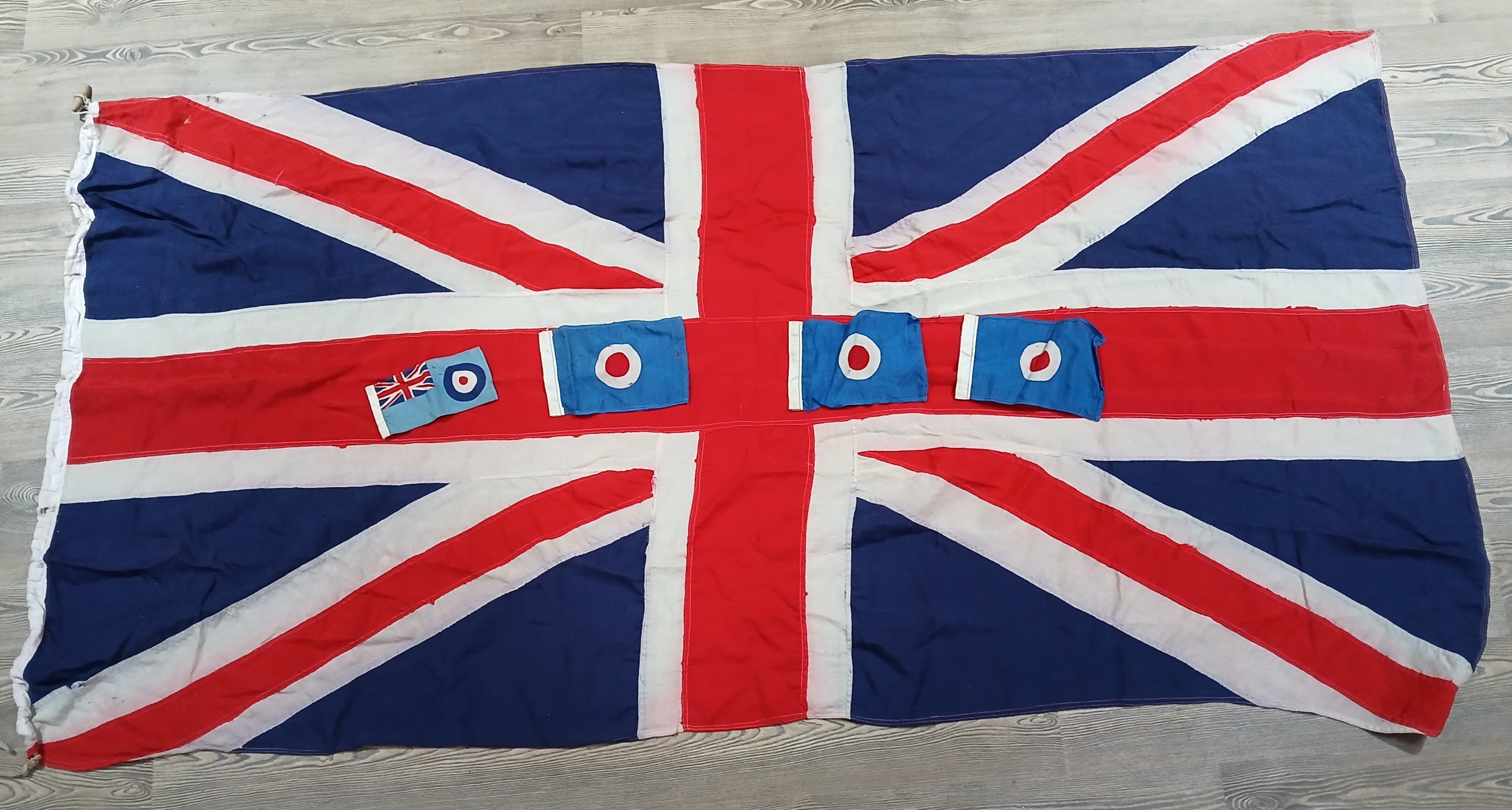A vintage Union Jack flag and 132cm x 247cm and four small RAF vehicle ...