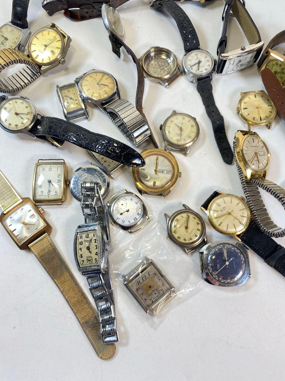 A large box of assorted wrist watches