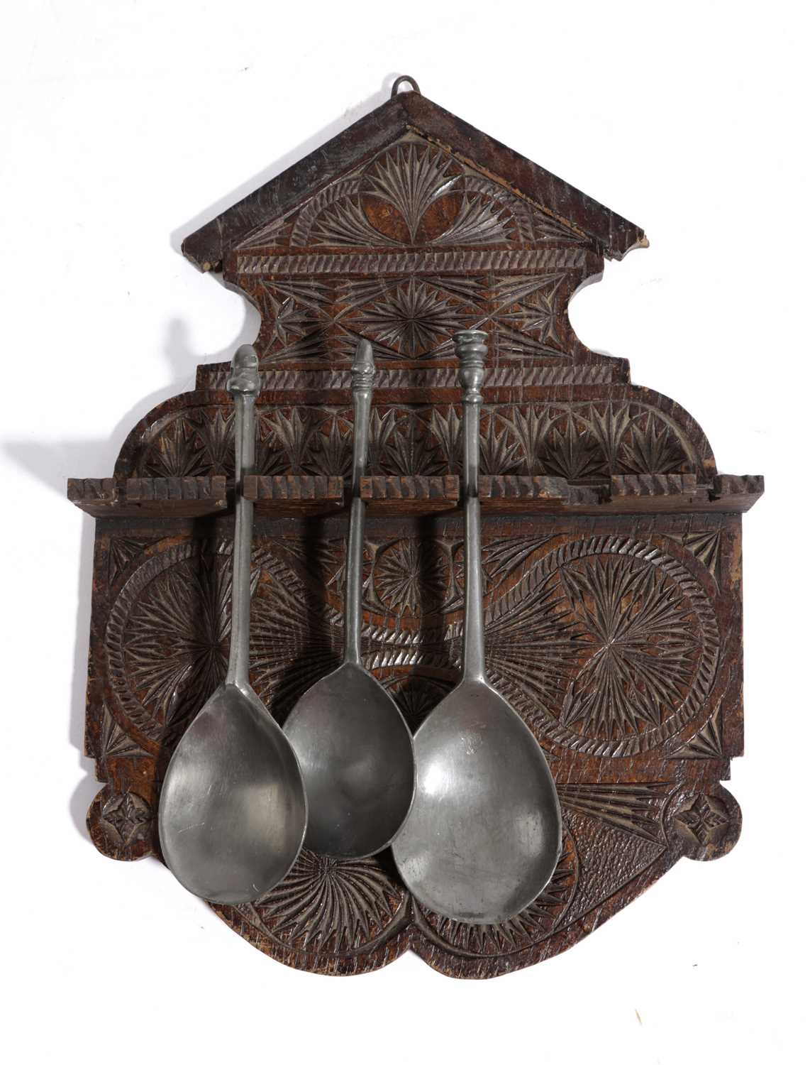 A TREEN OAK SPOON RACK 19TH CENTURY with chipped carved whorl and ...