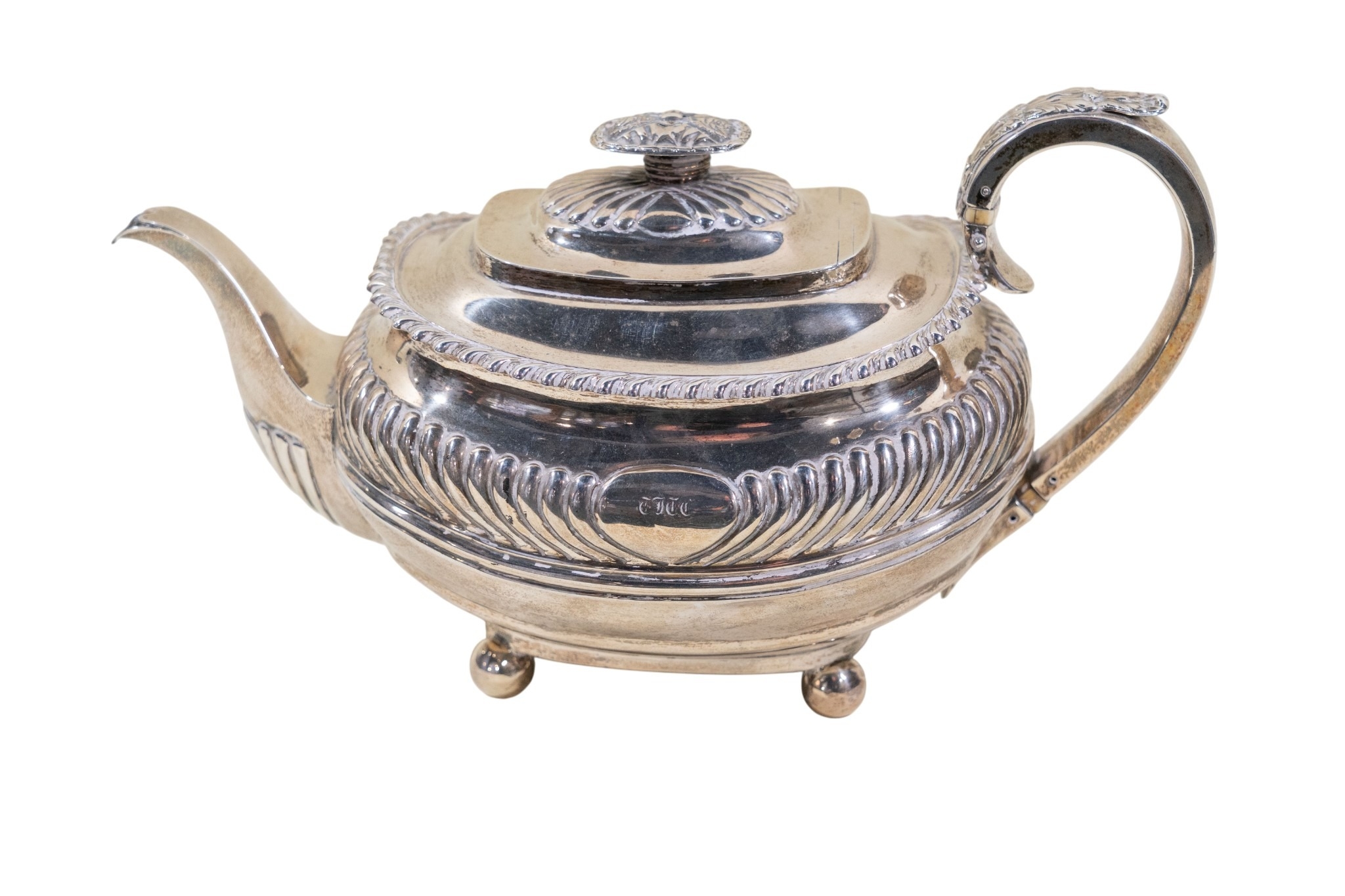 A George IV silver teapot, London, 1824 by Hester Bateman, the oval ...