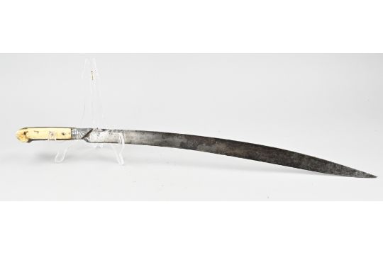 An Ottoman saber, Yatagan, with a slightly curved blade. The hilt is ...