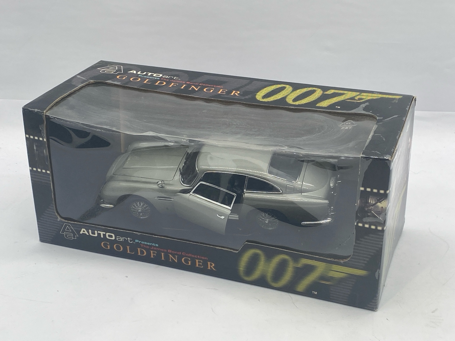 AutoArt, a 1:18 scale James Bond 007 Aston Martin DB5 from "Goldfinger ...