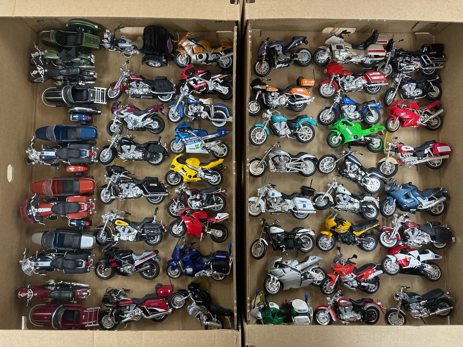 A boxed group of assorted die-cast motorcycle models by mixed ...