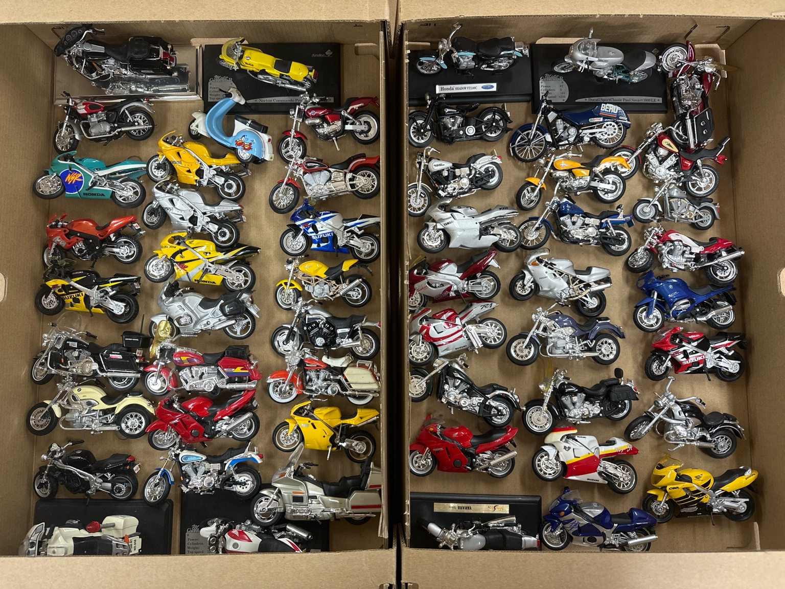 A boxed group of assorted die-cast motorcycle models by mixed ...